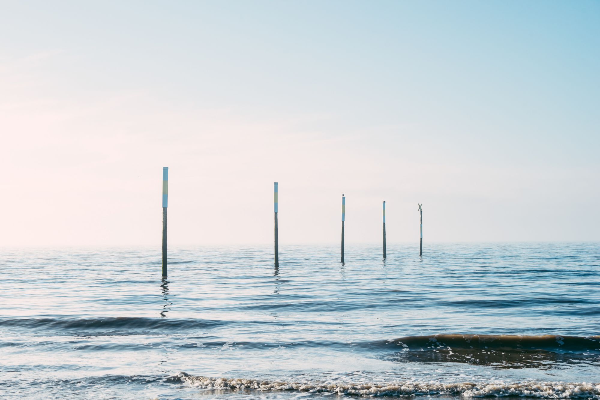 Poles In Sea – Free Stock Photo